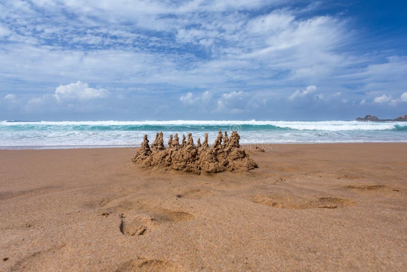 Sand castle on the beach stock photo. Image of seashore - 56343086