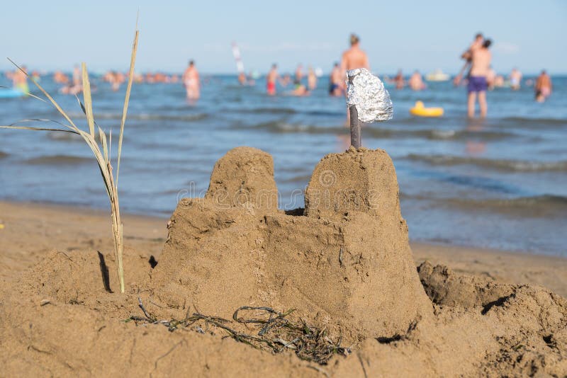 Sandcastle overlooking sea stock image. Image of characters - 107996387