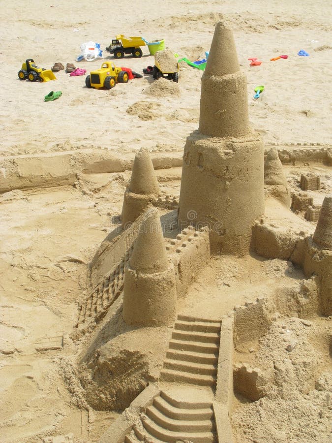 Sand Castle Tower and Toy Trucks Stock Photo - Image of summer, sandy ...