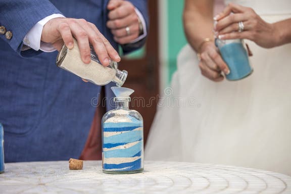 Sand ceremony at wedding stock photo. Image of hands - 76290718
