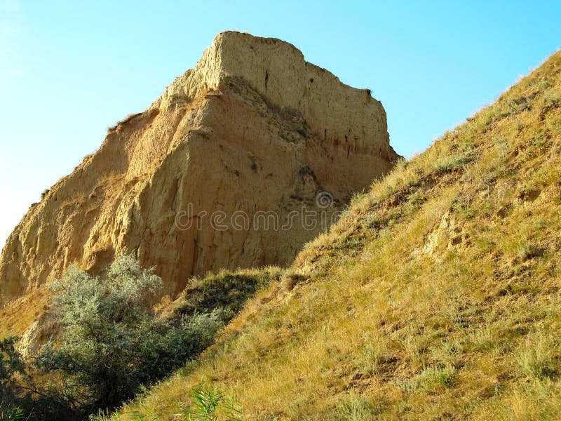 Sand cliff lit by the sun stock photo. Image of europe - 181842470