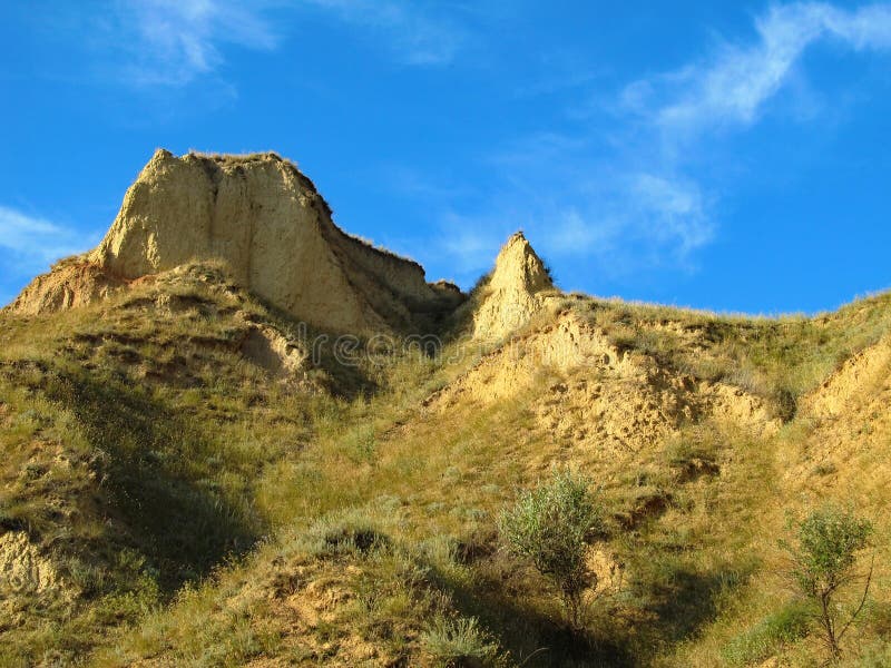 Sand Cliffs at Sunset on a Blue Sky Background Stock Image - Image of ...
