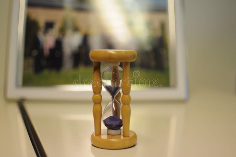 Sand clock on the table stock photo. Image of investment - 145607970