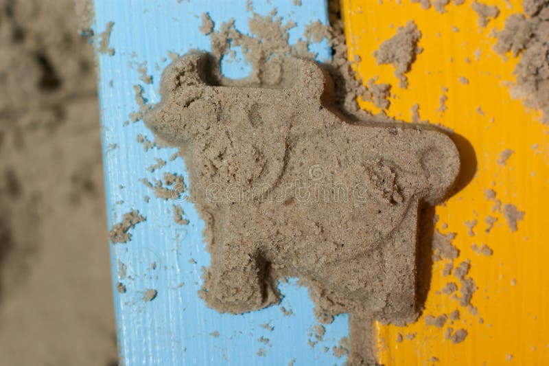 Sand cow on bright bench stock image. Image of sand, bank - 38850873