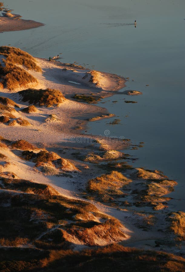 Sand dune lagoon stock image. Image of light, setting - 2473545