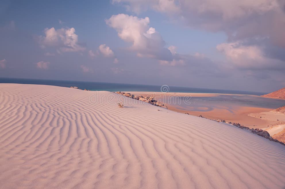 Sand Dune with a Relief Pattern of Sand and a View of the Emerald Ocean. Stock Photo - Image of ...