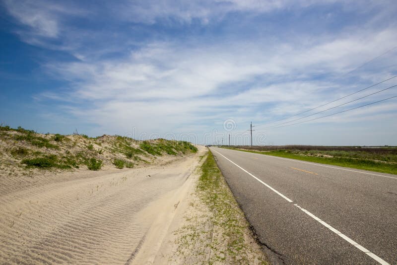 Sand Dunes along Highway stock image. Image of deserted - 56864137