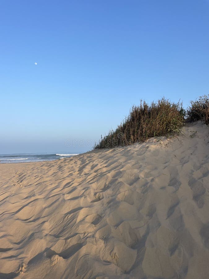 Sand Dunes and Ocean Under the Moon Stock Photo - Image of sunset, moon ...