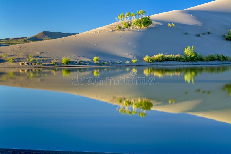 Sand Dunes and Pond of Water with Reflection Stock Image - Image of ...