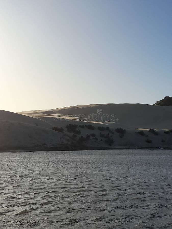 Sand Dunes and River Water at Sundown Stock Photo - Image of swim ...