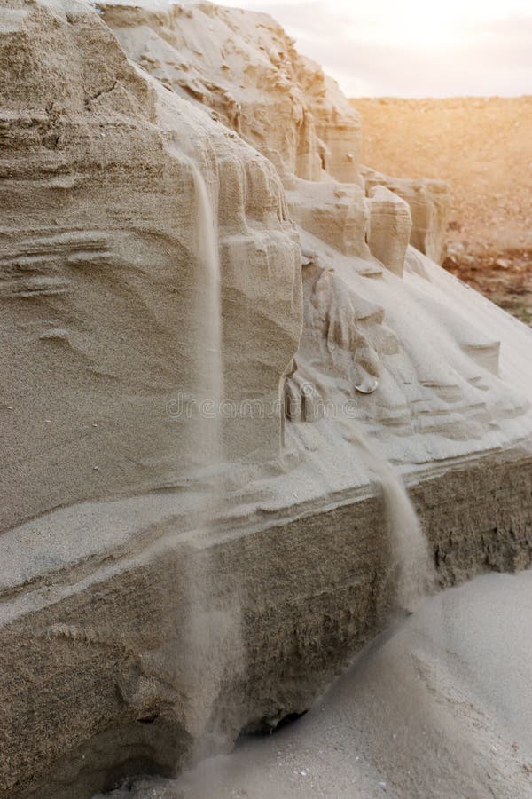 Sand fall on the beach stock photo. Image of falls, sunlight - 282652462