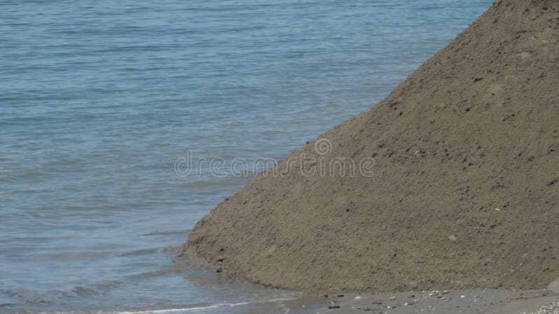Sand Falling in the Beach in Works of Regeneration of Beaches Stock ...