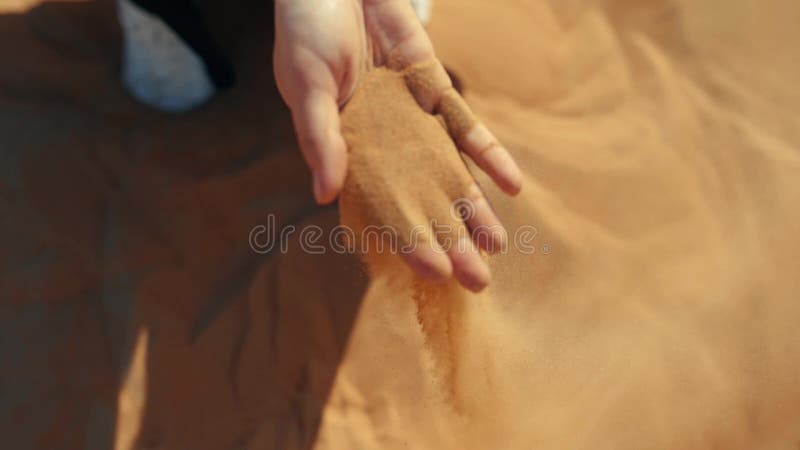 Sand falling out of hand stock footage. Video of time - 258907368