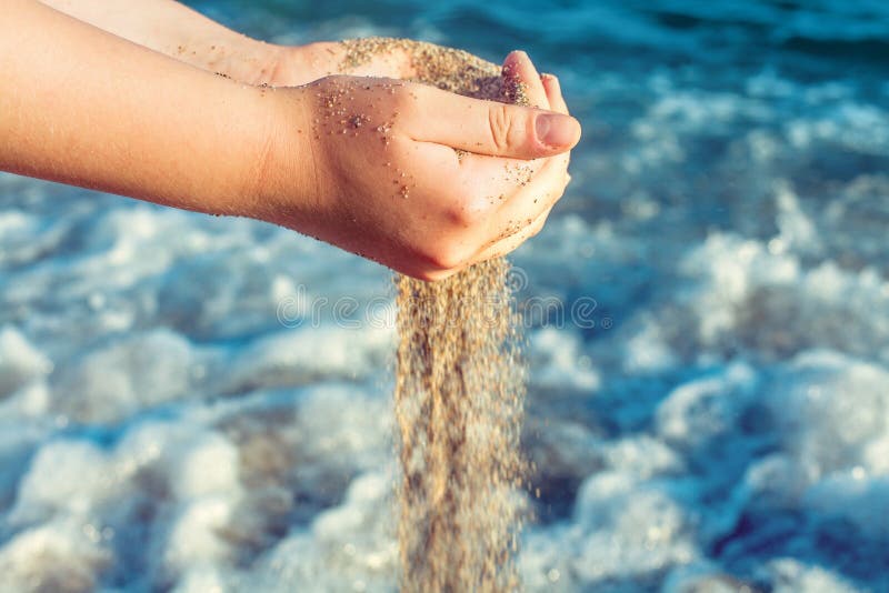 Sand Falling From The Hands On Sea Beach Background. Happy Holiday And ...