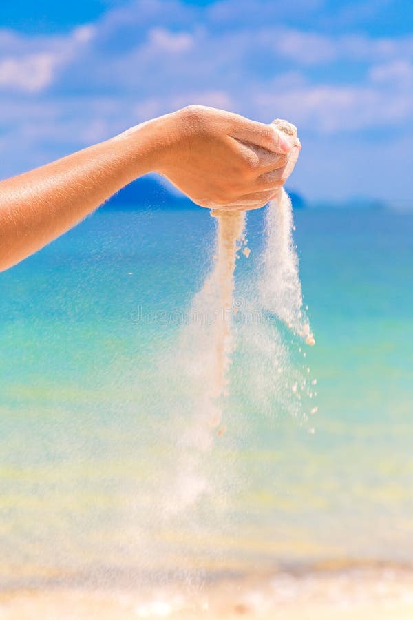 Sand Falling through Woman Hands Stock Image - Image of motion, falling ...