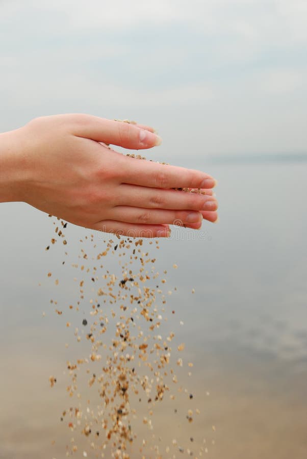 Sand in female hands stock image. Image of monotone, blue - 2649409
