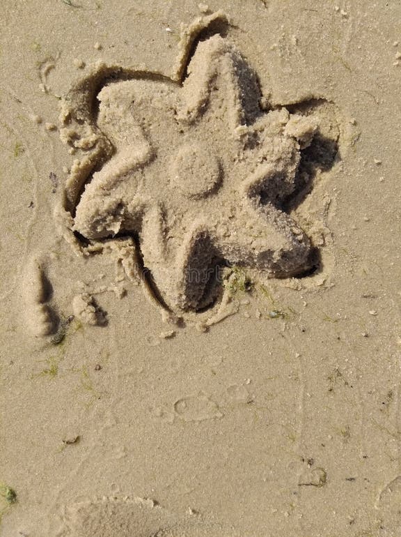 Sand Figure in the Shape of a Star on the Sand Stock Photo - Image of ...