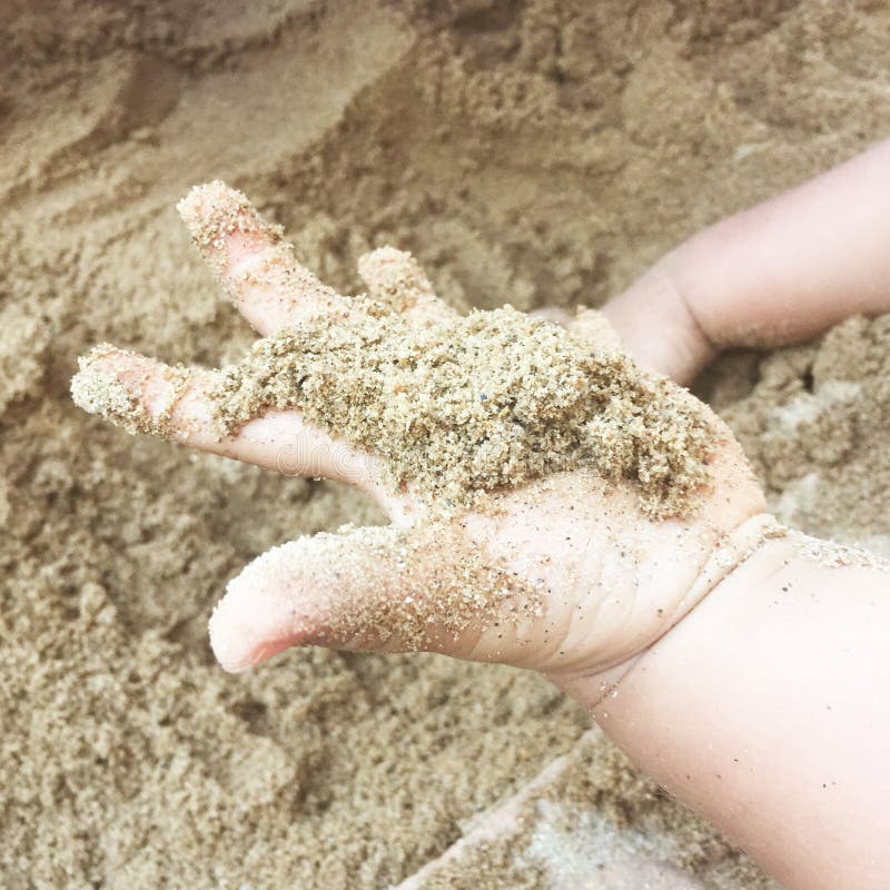Sand in Hand Child Age 2 Years Stock Photo - Image of kids, earth ...