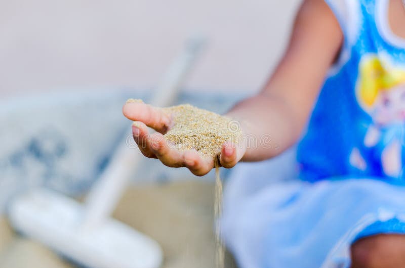 Sand on hand. stock photo. Image of water, sandy, happy - 56223024