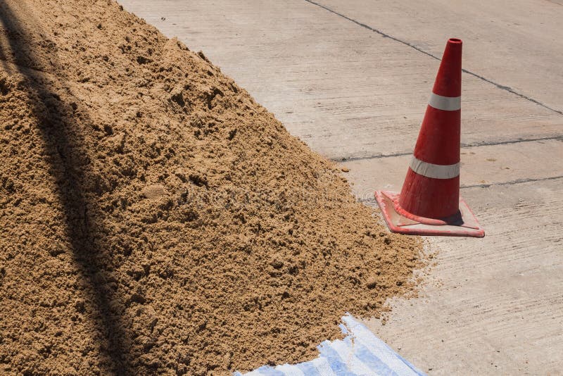 Sand Heap for Construction and Red Funnel Traffic. Stock Image - Image ...