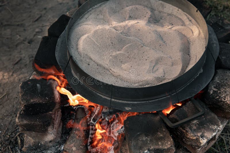 The Sand is Heated on the Fire To Make Coffee. Stock Image - Image of ...