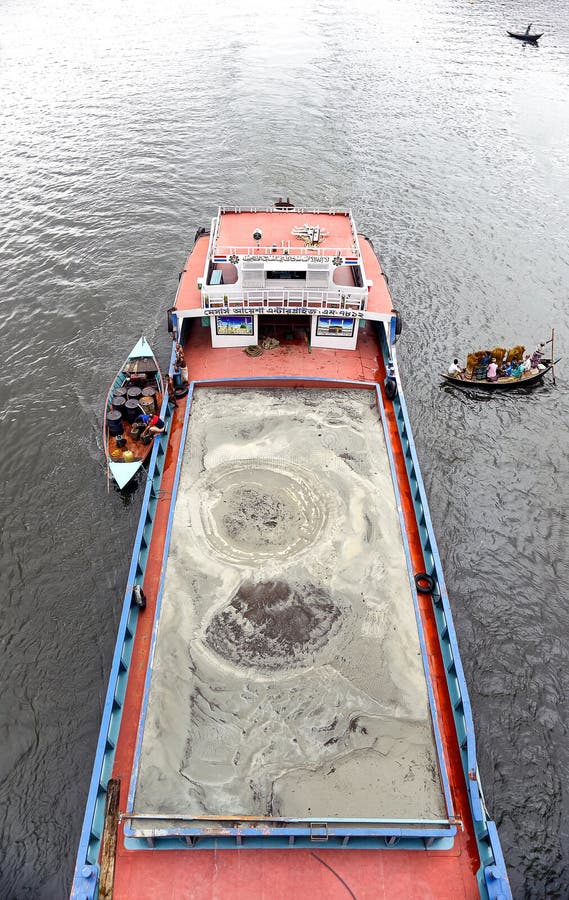 Sand-loaded Cargo Vessel with Small Boats on River. Editorial Photo ...