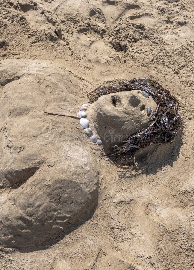 Sand Man Sculpture on the Beach with Decorations Stock Photo - Image of ...