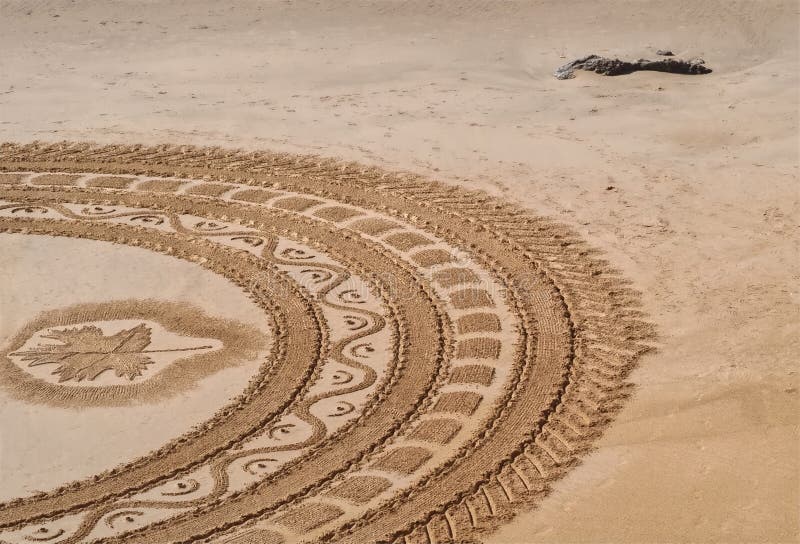 Sand Mandala with a Maple Leaf on the Beach Stock Image - Image of agua ...