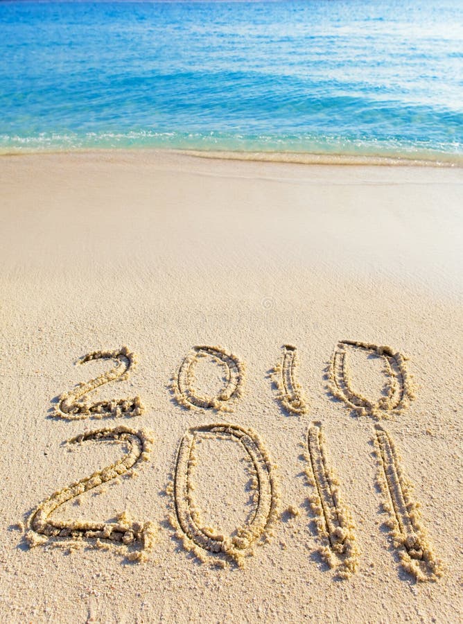 On Sand at Ocean Edge it is Written 2011 Stock Photo - Image of surf ...