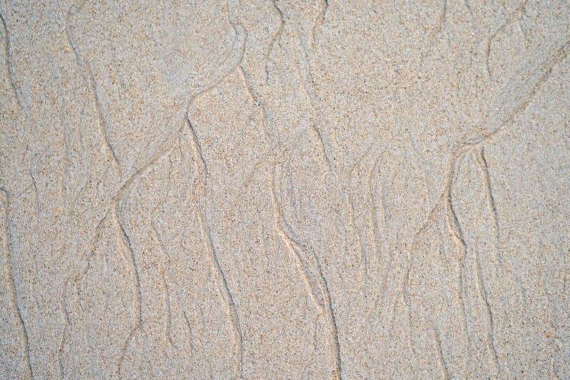 Sand pattern on the beach stock photo. Image of coastline - 135053350