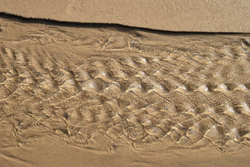 Sand Patterns and Moving Water Stock Photo - Image of movement ...