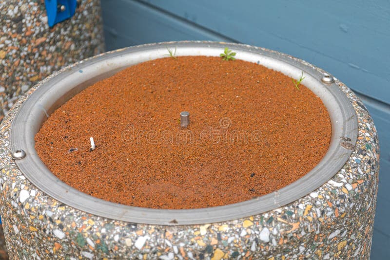 Sand Pit Ashtray stock photo. Image of cigarettes, sand - 224992452