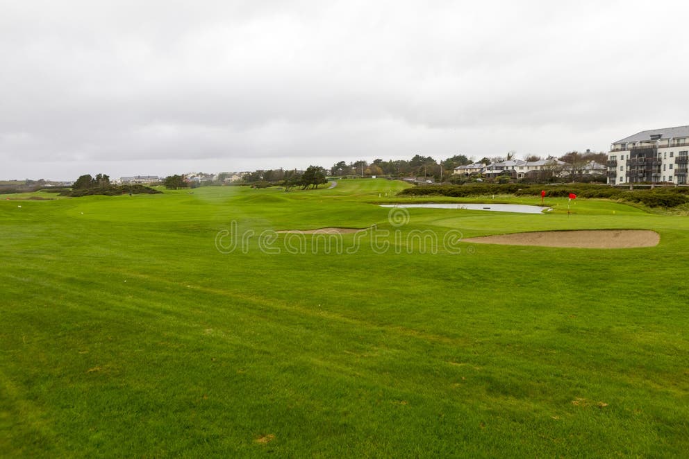 Sand pit on a golf course stock photo. Image of cloudy - 340131552