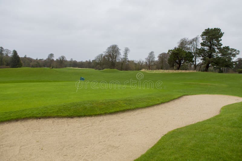 Sand pit on a golf course stock photo. Image of hole - 177899500