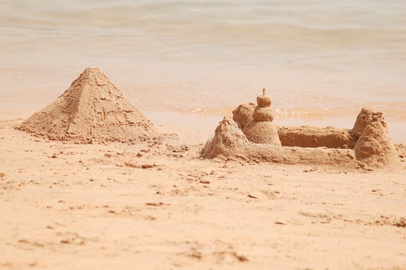 Pyramid Shaped Sand Castle stock photo. Image of sand - 3415540