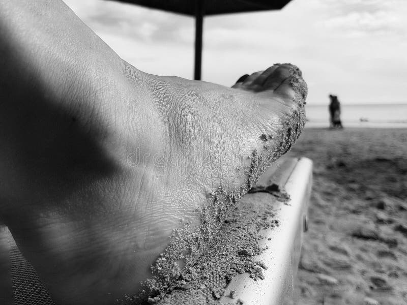 Sand on the right foot stock image. Image of snow, foot - 233203499