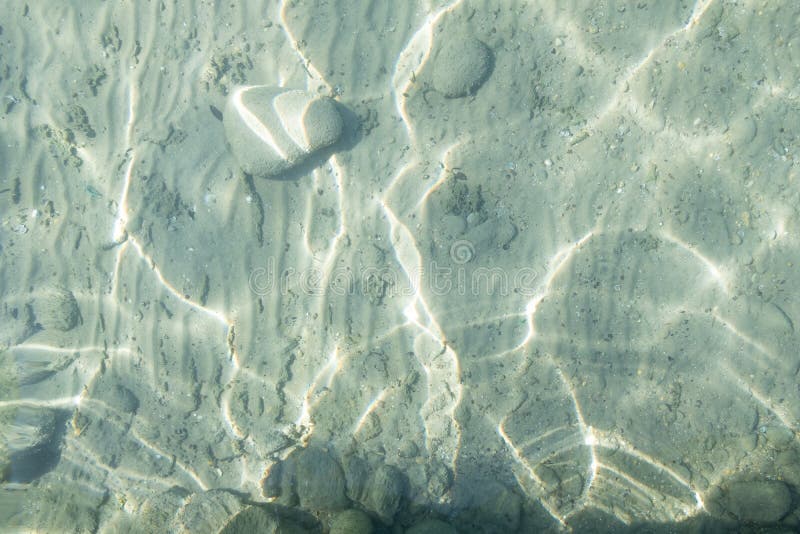 Sand Ripples and Rocks on the Seabed Stock Image - Image of sand ...