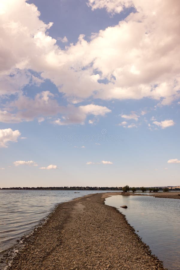 Sand road across the lake. stock image. Image of sunlight - 96828195