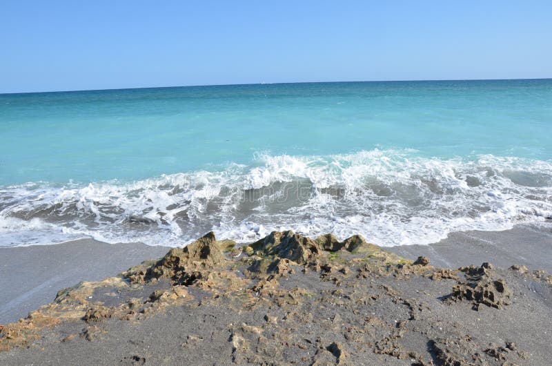 Sand and Rocks and Ocean Water at Beach Stock Photo - Image of water ...