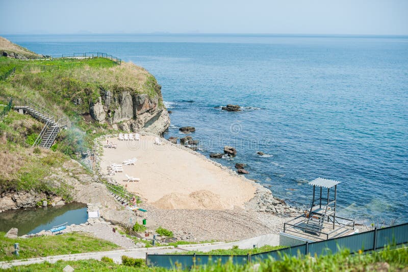 Sand on the rocky beach stock photo. Image of sandy - 159645552