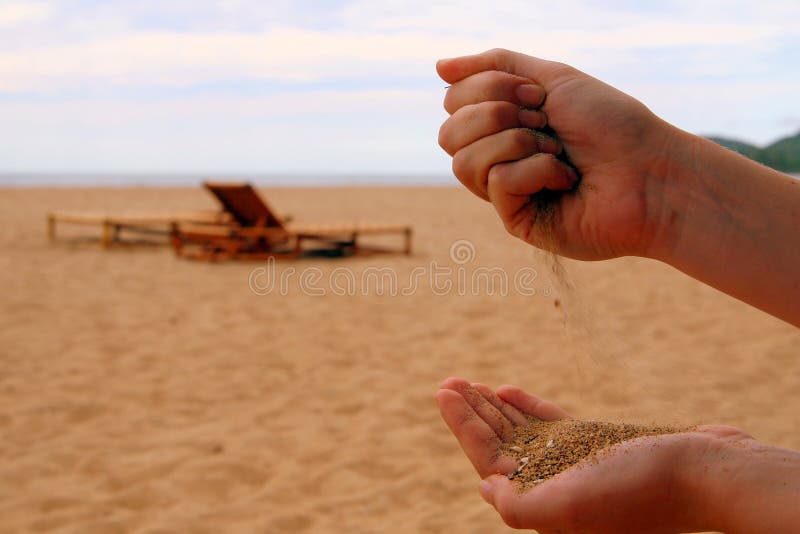 Boy Looking through a Sand Castle on the Beach Stock Photo - Image of ...