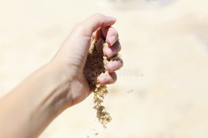 Sand Running through Hand of Woman in the Beach Stock Photo - Image of ...