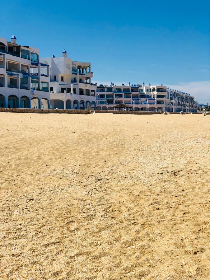 Sand Scene in Front of Buildings Stock Image - Image of architecture ...
