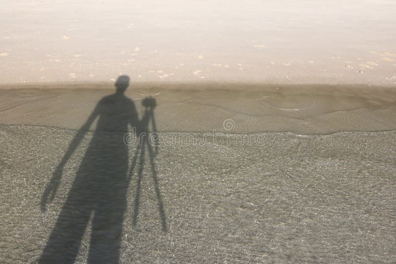 Sand and Sea Water with Shadow of Photographer on the Beach. Stock ...