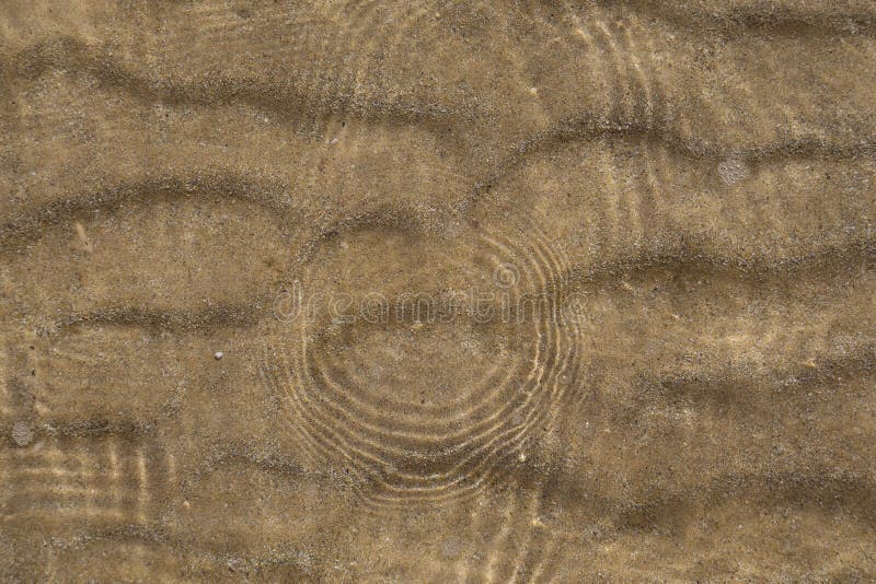 Sand in shallow sea stock image. Image of reflections - 77509893