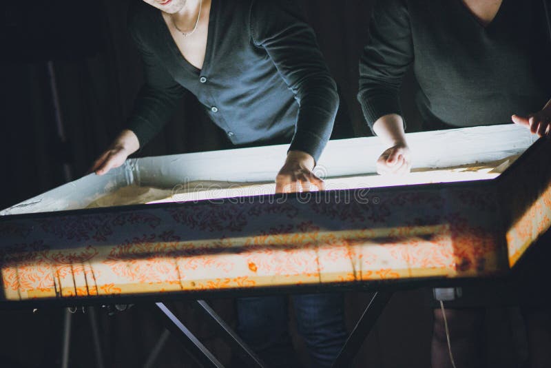 Sand show on a glass table stock photo. Image of hands - 68871104