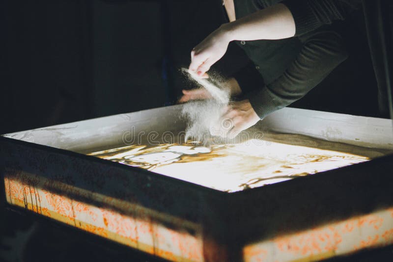 Sand show on a glass table stock image. Image of texture - 68871147