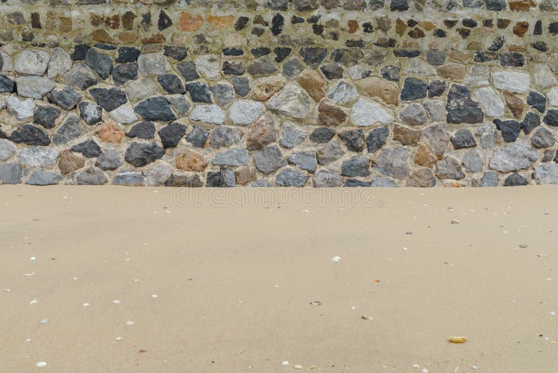 Sand with Stone Wall on the Beach Stock Image - Image of rock ...