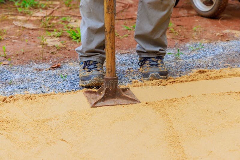 Sand Tamping with Worker Uses a Manual Rammer Stock Photo - Image of ...