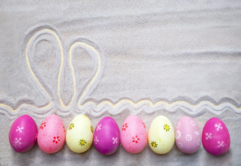 Sand Texture with Colorful Easter Eggs and Drawing Rabbit S Ears on the ...